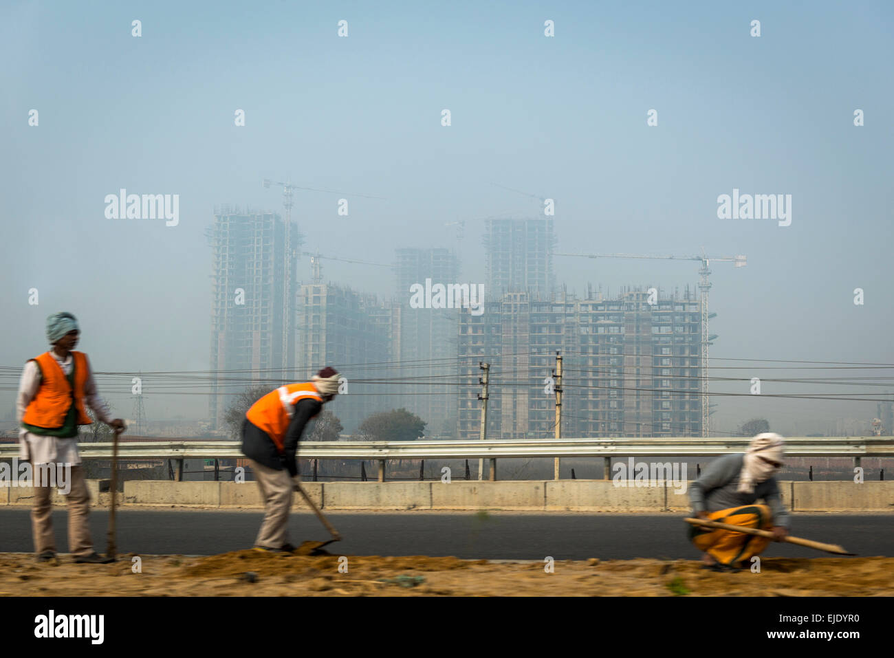 Huge roadside building development along the motorway between New Delhi ...