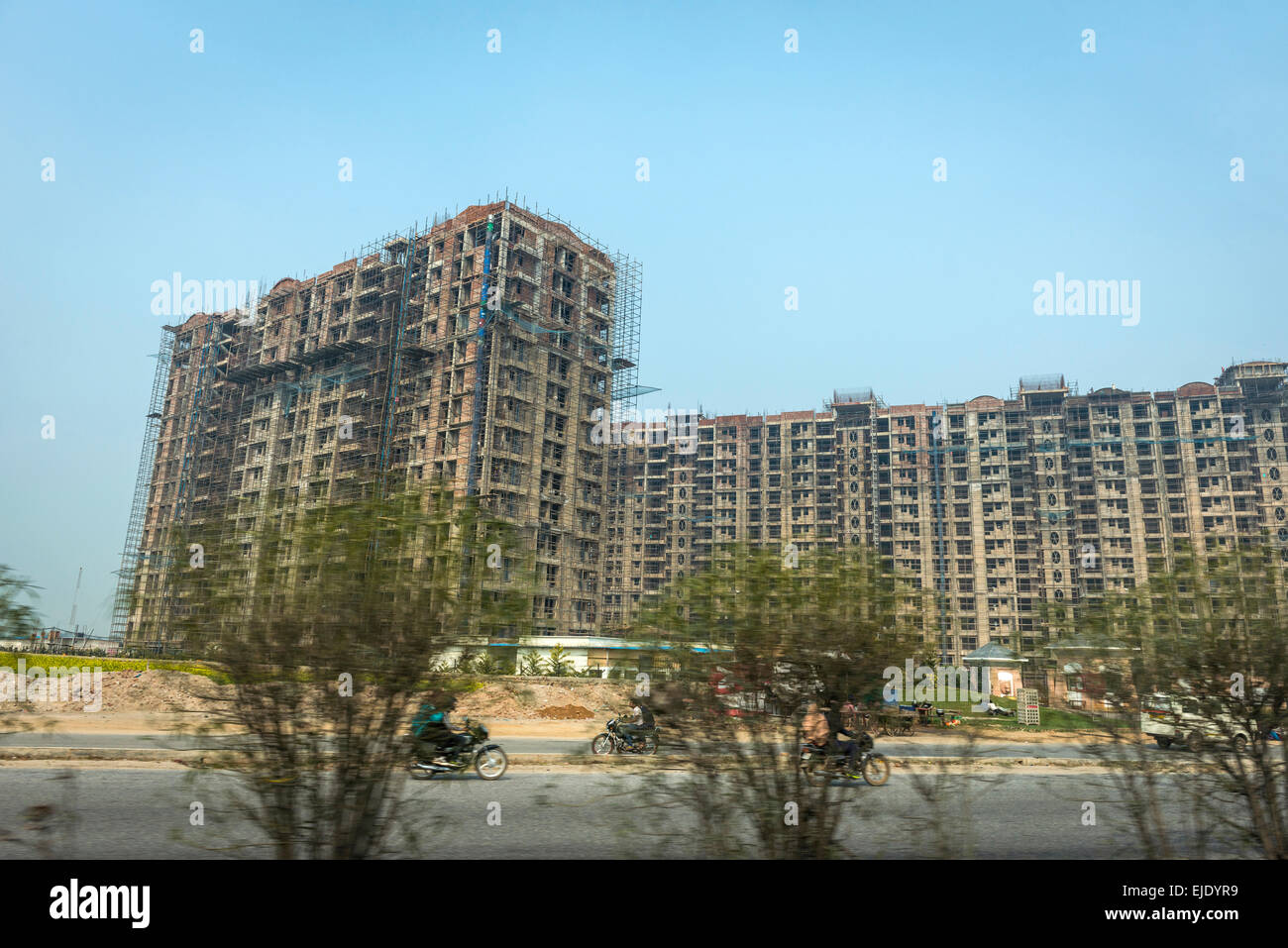Huge roadside building development along the motorway between New Delhi ...