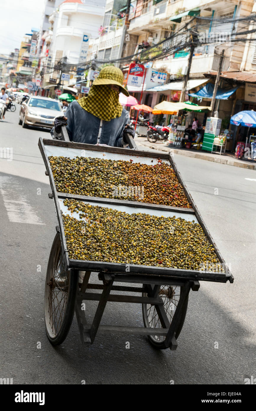Vendor selling cooked hot and spicy shells on the street in Phnom Penh ...