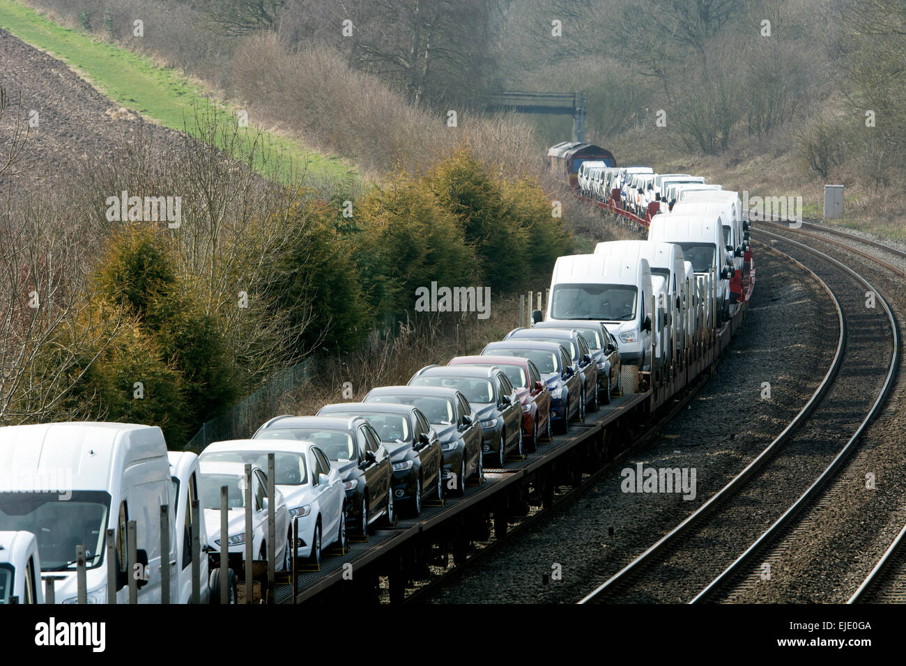 Train carrying new Ford cars and vans at Hatton Bank, Warwickshire, UK ...