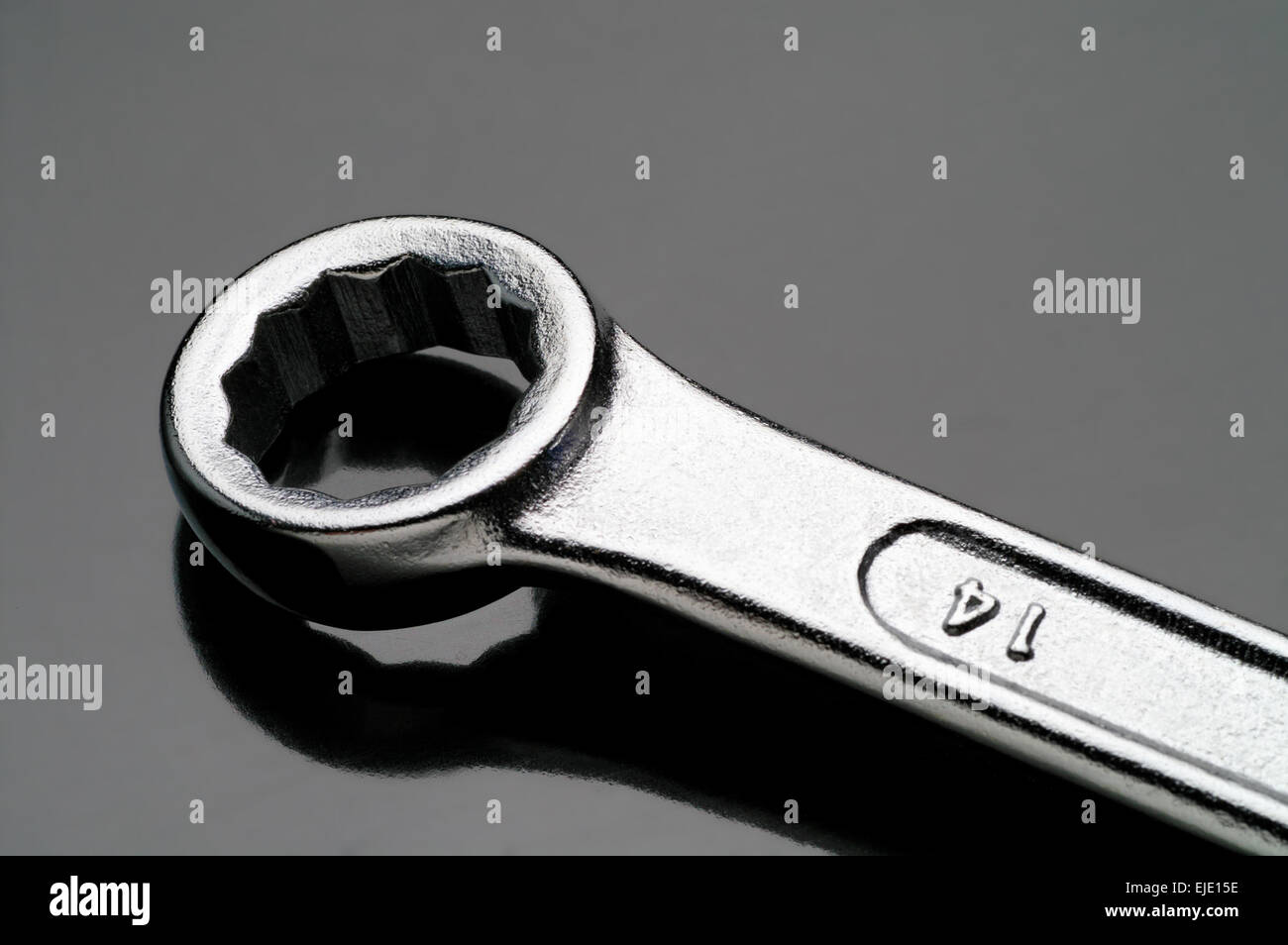 Wrench on black background Stock Photo - Alamy