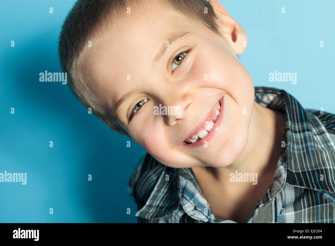 boy with a blue background behind Stock Photo - Alamy