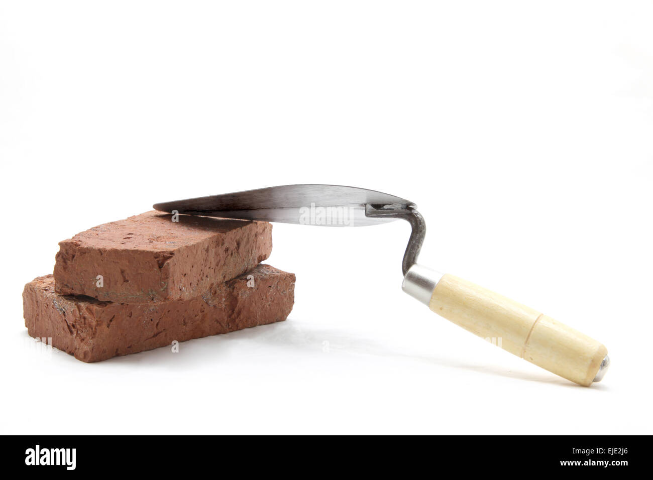 isolated of construction lute trowel with red brick on white Stock ...