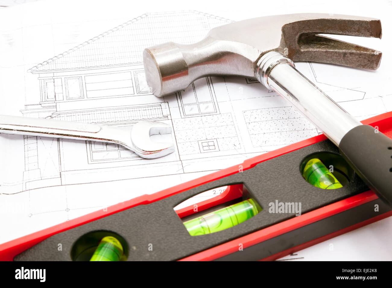 Construction tools over a construction drawing of a house blueprint ...
