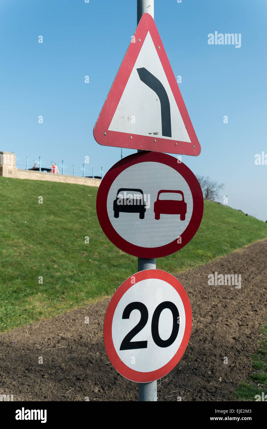 three road signs together on a private road Stock Photo - Alamy