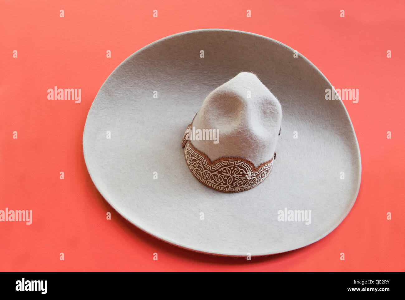 Mexican style bullfighter grey hat, isolated over red background Stock ...