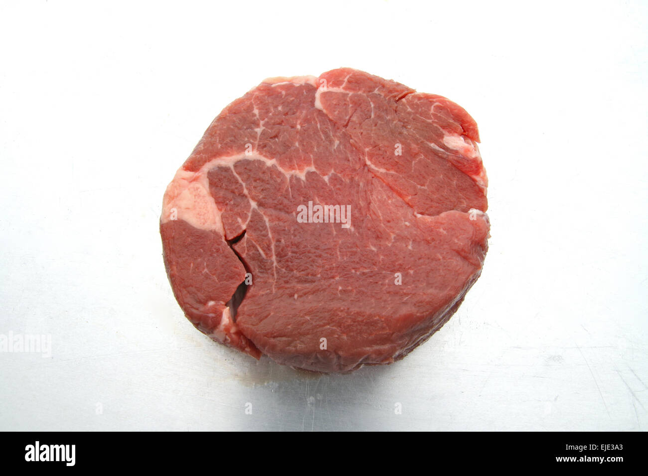 raw beef tender loin on steel plate Stock Photo - Alamy