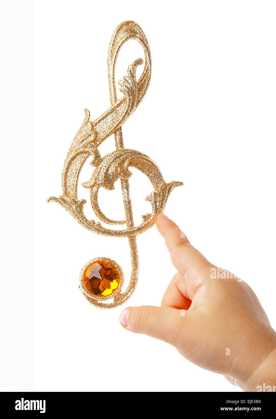 Baby finger indicates Christmas treble clef toy isolated on white ...