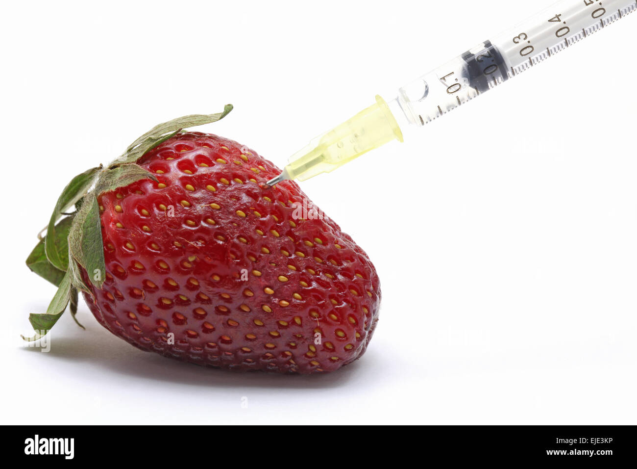Genetic food engineering concept with Strawberry and syringe Stock ...