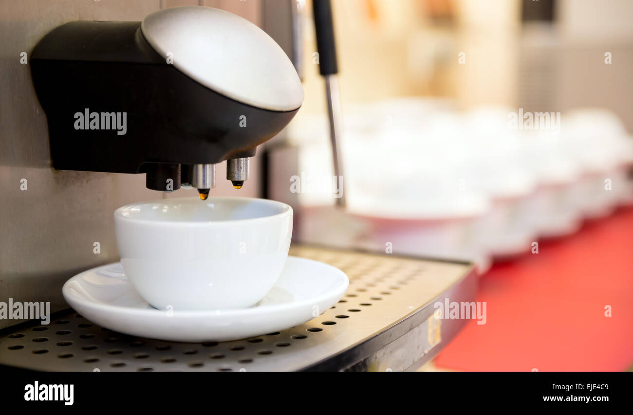 Hot Espresso form Coffee machine Stock Photo - Alamy