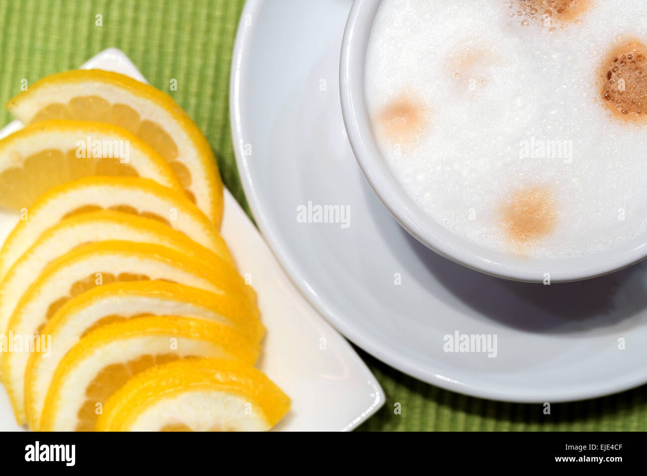 Hot Latte with lime slide Stock Photo - Alamy