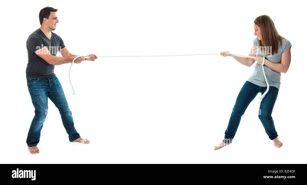 A couple on studio white background pull the rope Stock Photo - Alamy
