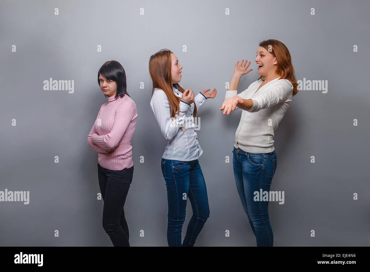 Two girls talking blonde European appearance and ignore the third girl ...