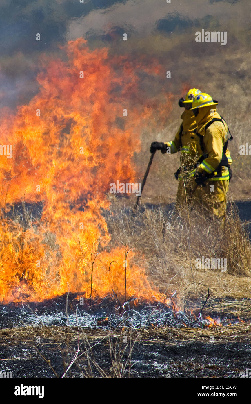 Firefighter Fighting Fire Stock Photo - Alamy