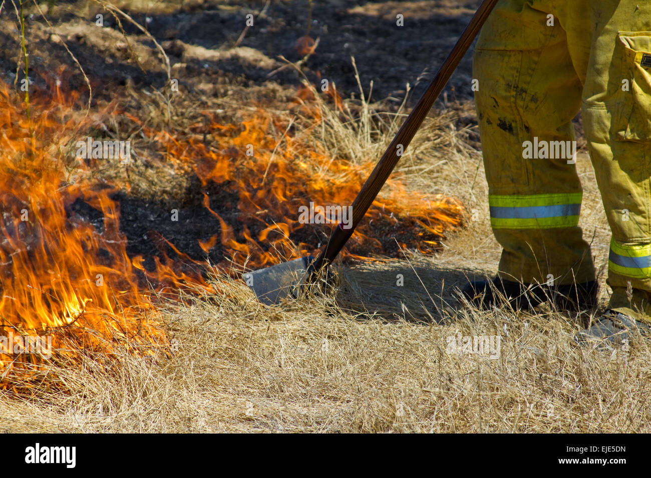 Firefighter Fighting Fire Stock Photo - Alamy