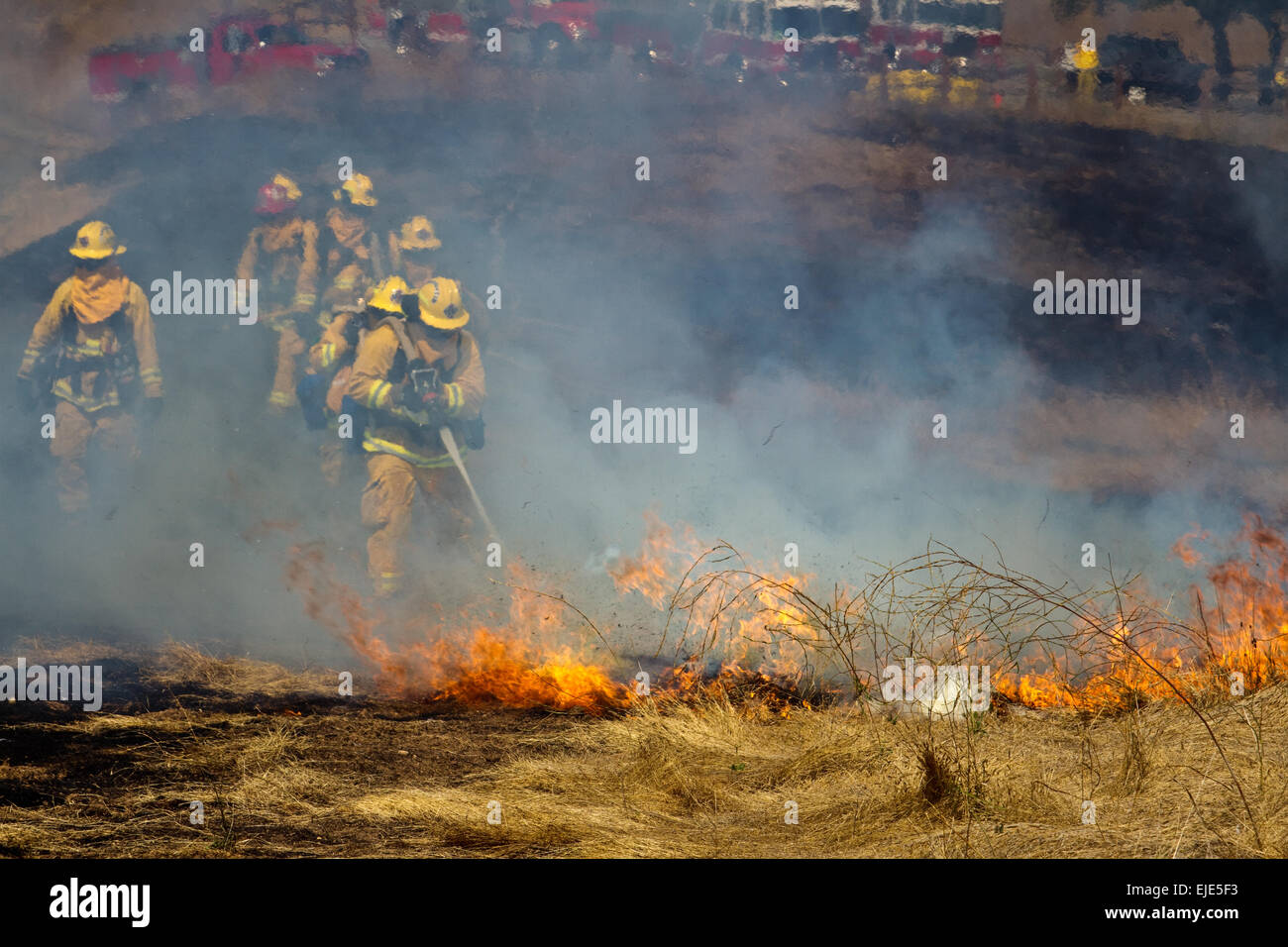 Firefighter Fighting Fire Stock Photo - Alamy