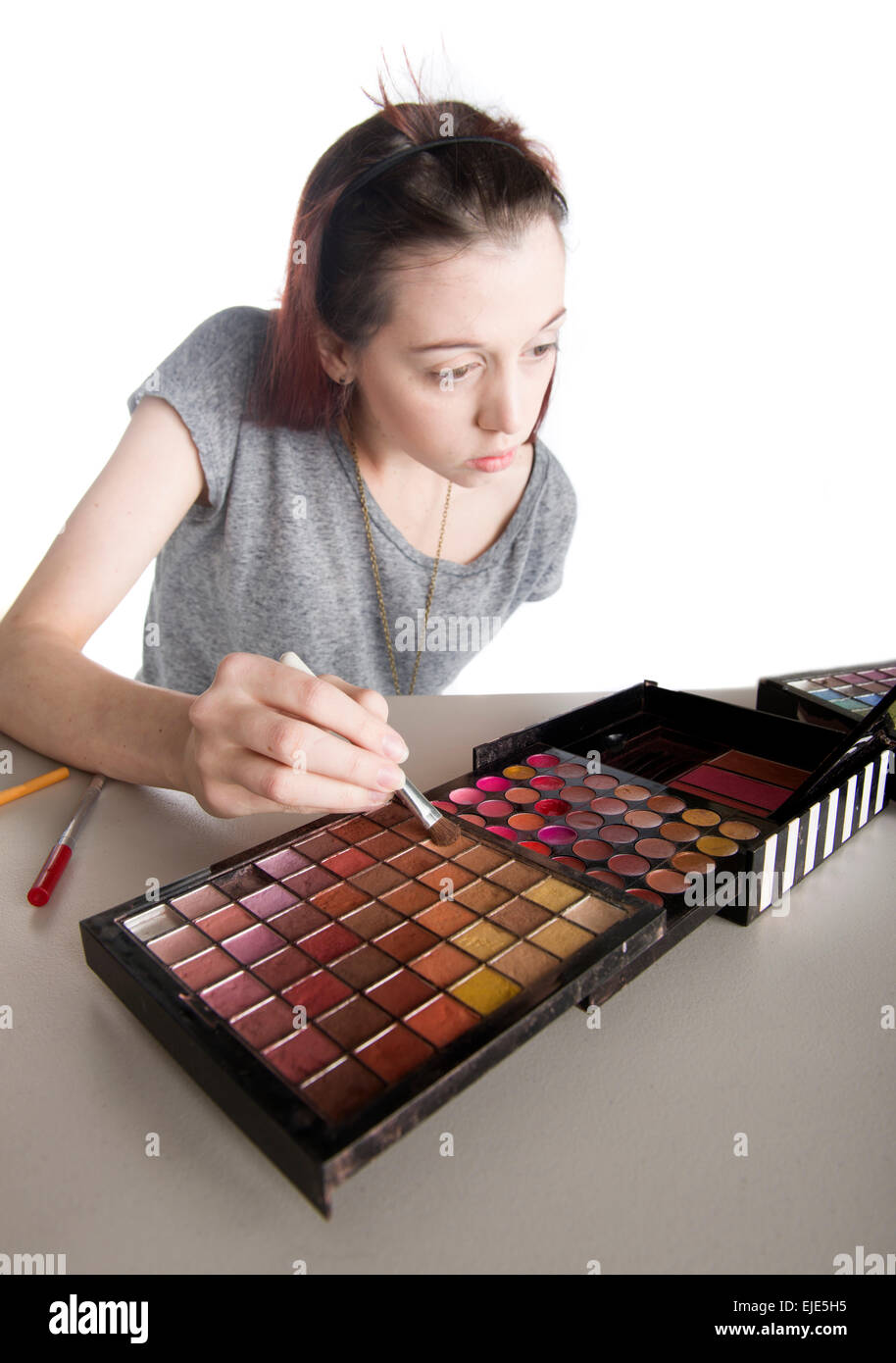 Young Woman Applying Make Up from Large Palette Stock Photo - Alamy