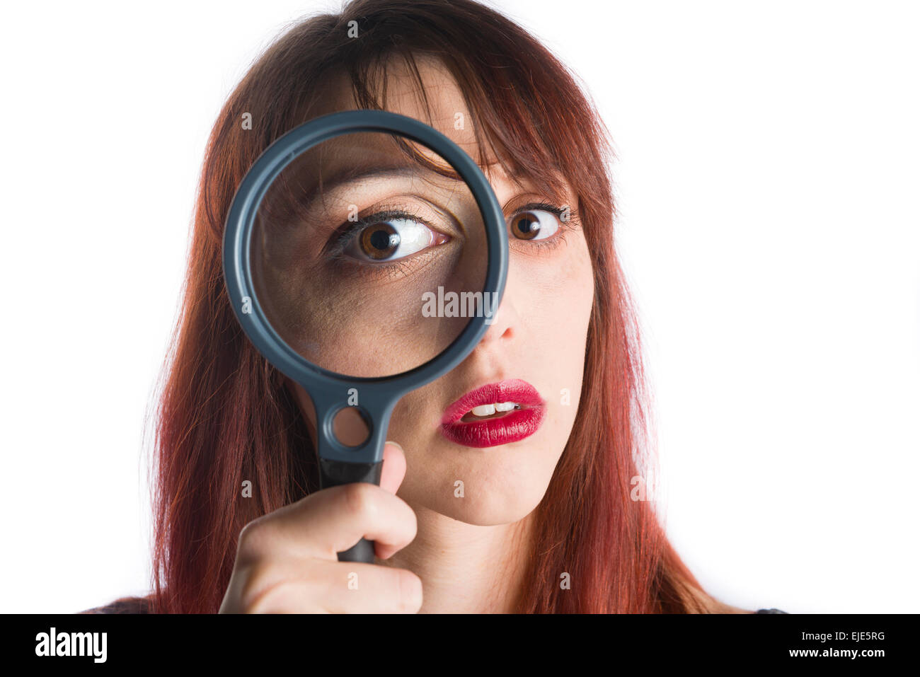Young Woman Looking Through Magnifying Glass Stock Photo - Alamy
