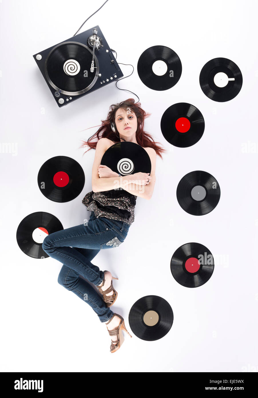 Woman Lying on Floor with Turntable and Records Stock Photo - Alamy