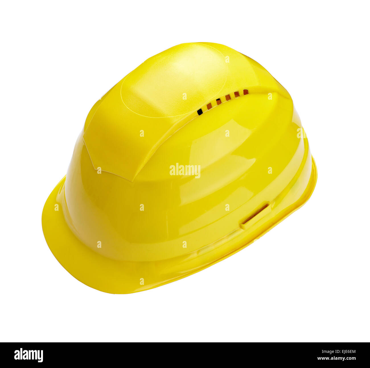 close up of a yellow construction helmet on white background with ...