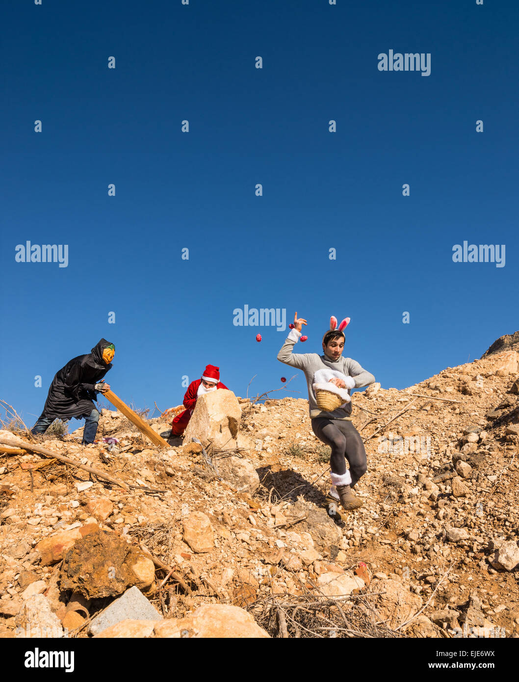 Santa and the Halloween monster ambushing the Easter Bunny Stock Photo ...