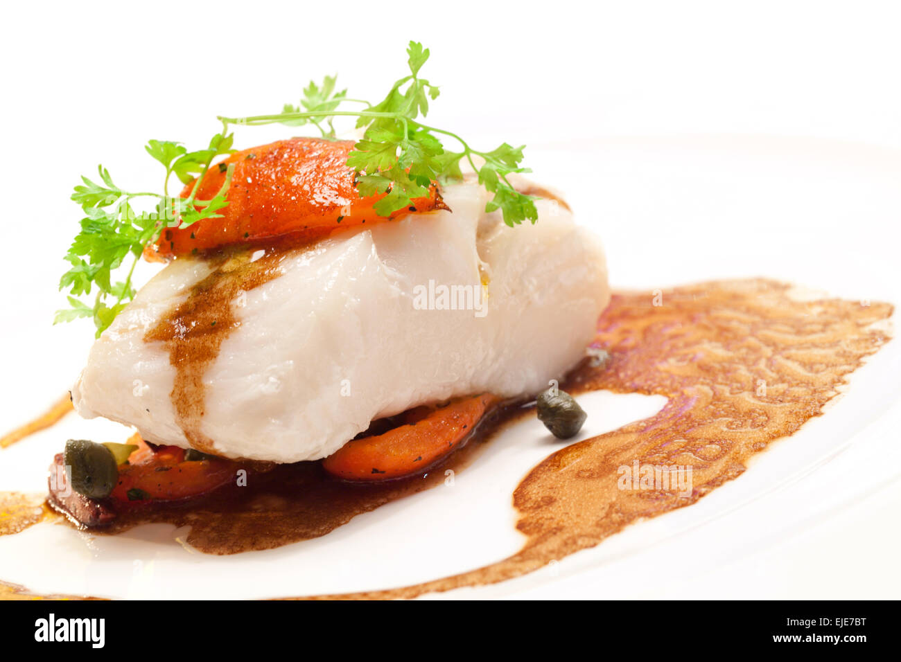 Gourmet Main Entree Course Grilled Snow Fish with brown sauce Stock ...