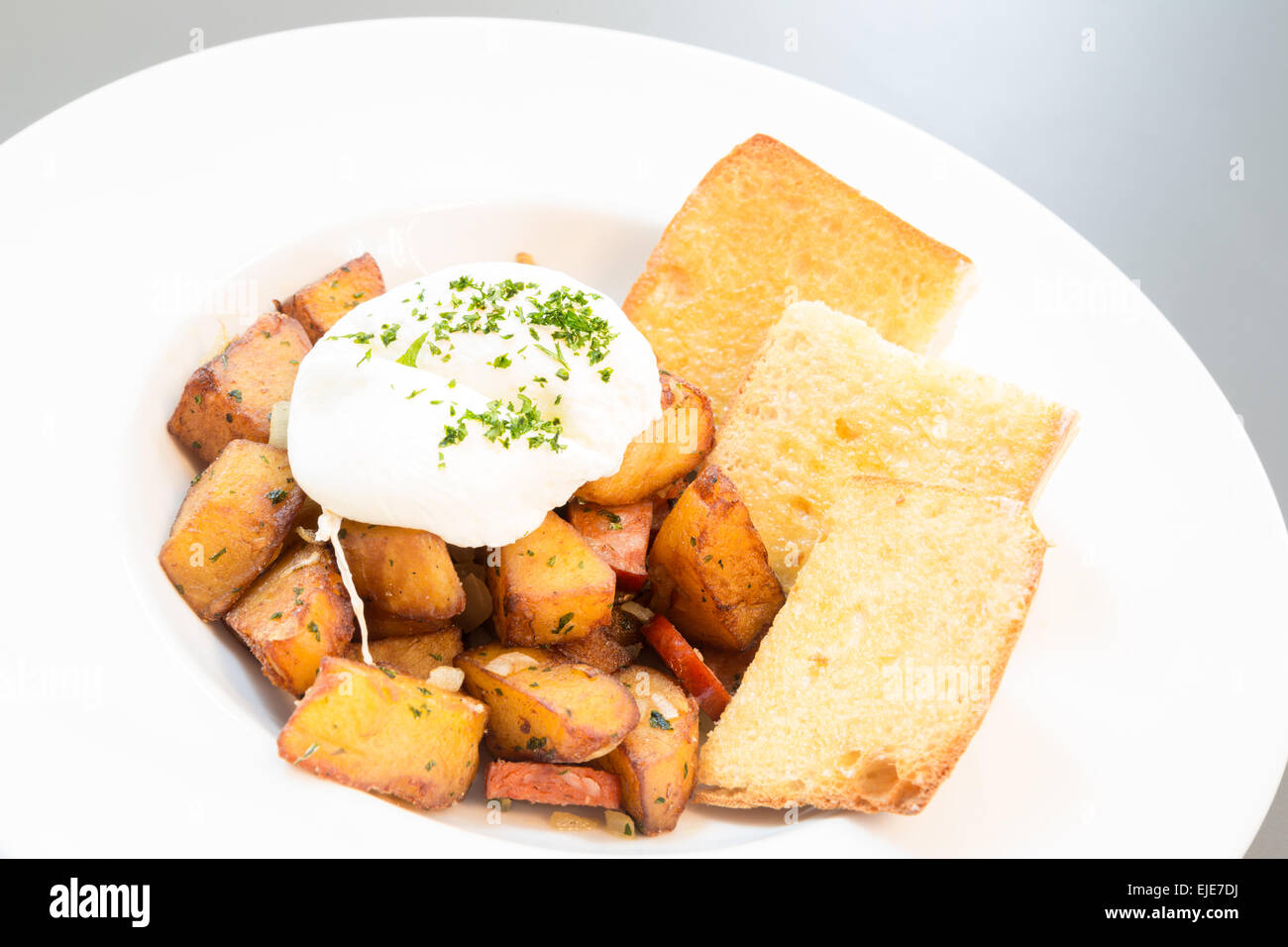 Spanish hash potato with cream Stock Photo - Alamy