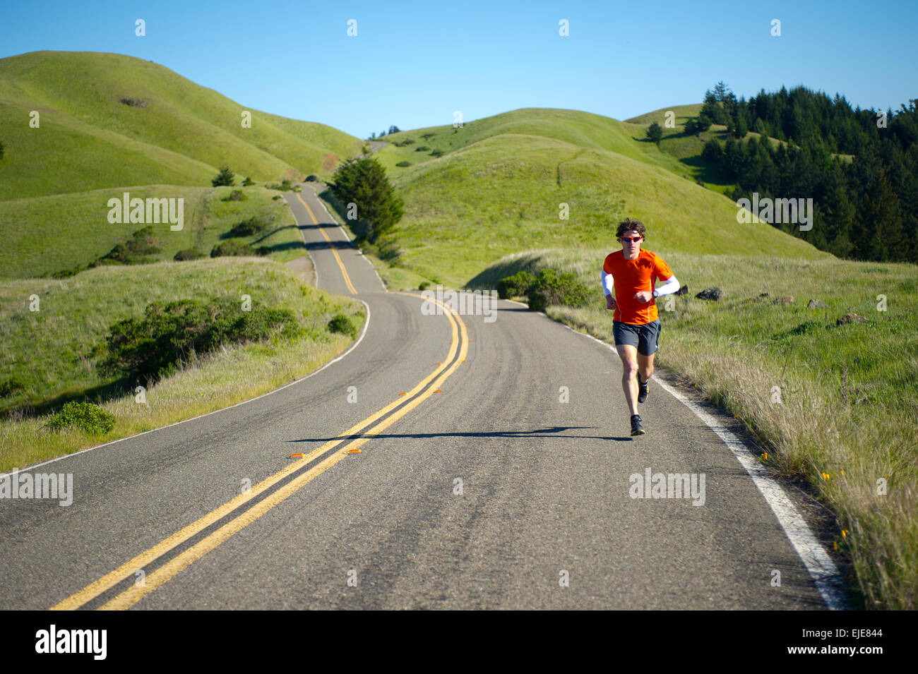 Man running in forest road hi-res stock photography and images - Alamy
