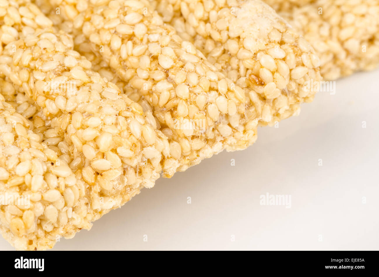 Closeup take of sesame bars isolated on white Stock Photo - Alamy