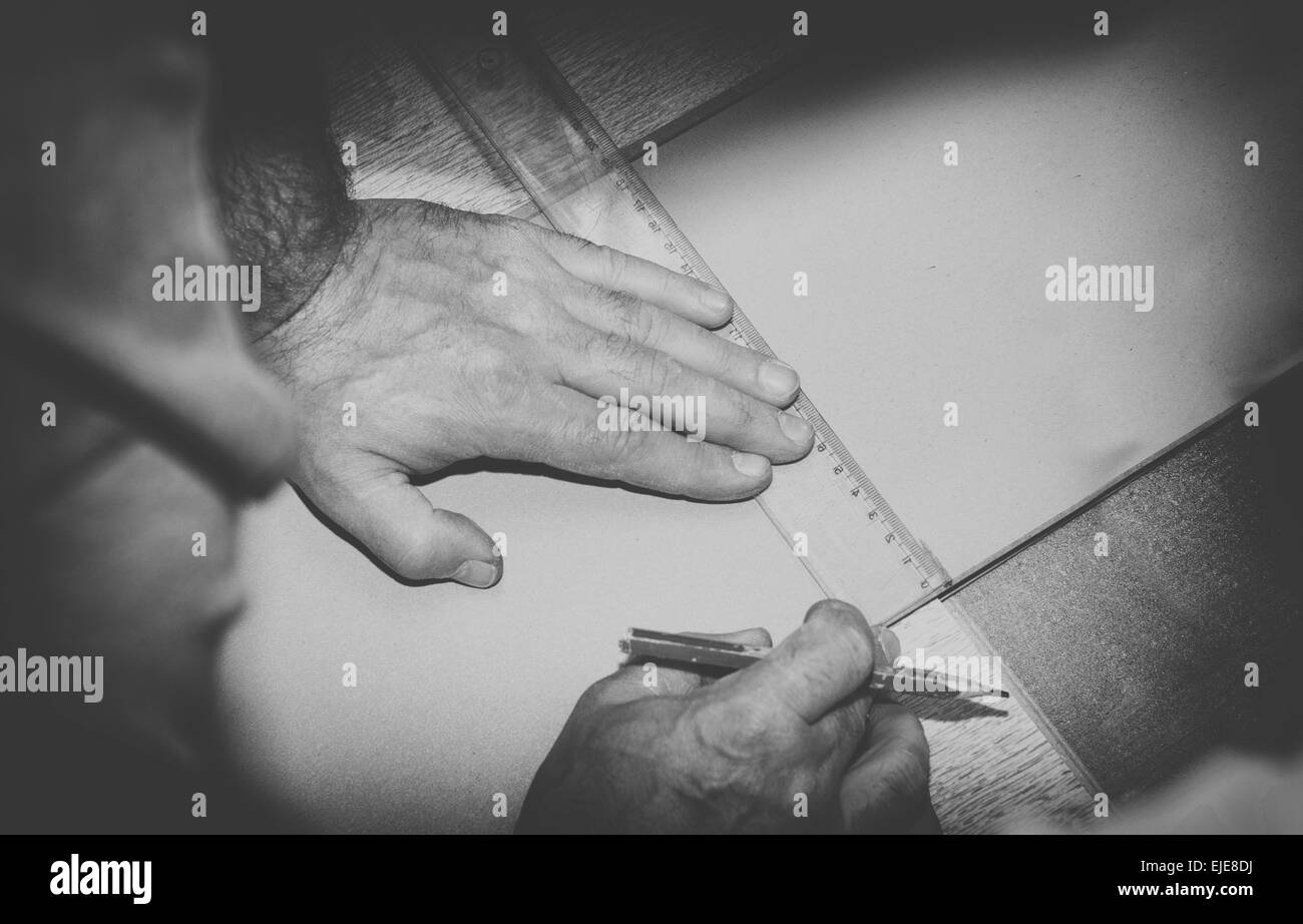 Using a ruler Black and White Stock Photos & Images - Alamy