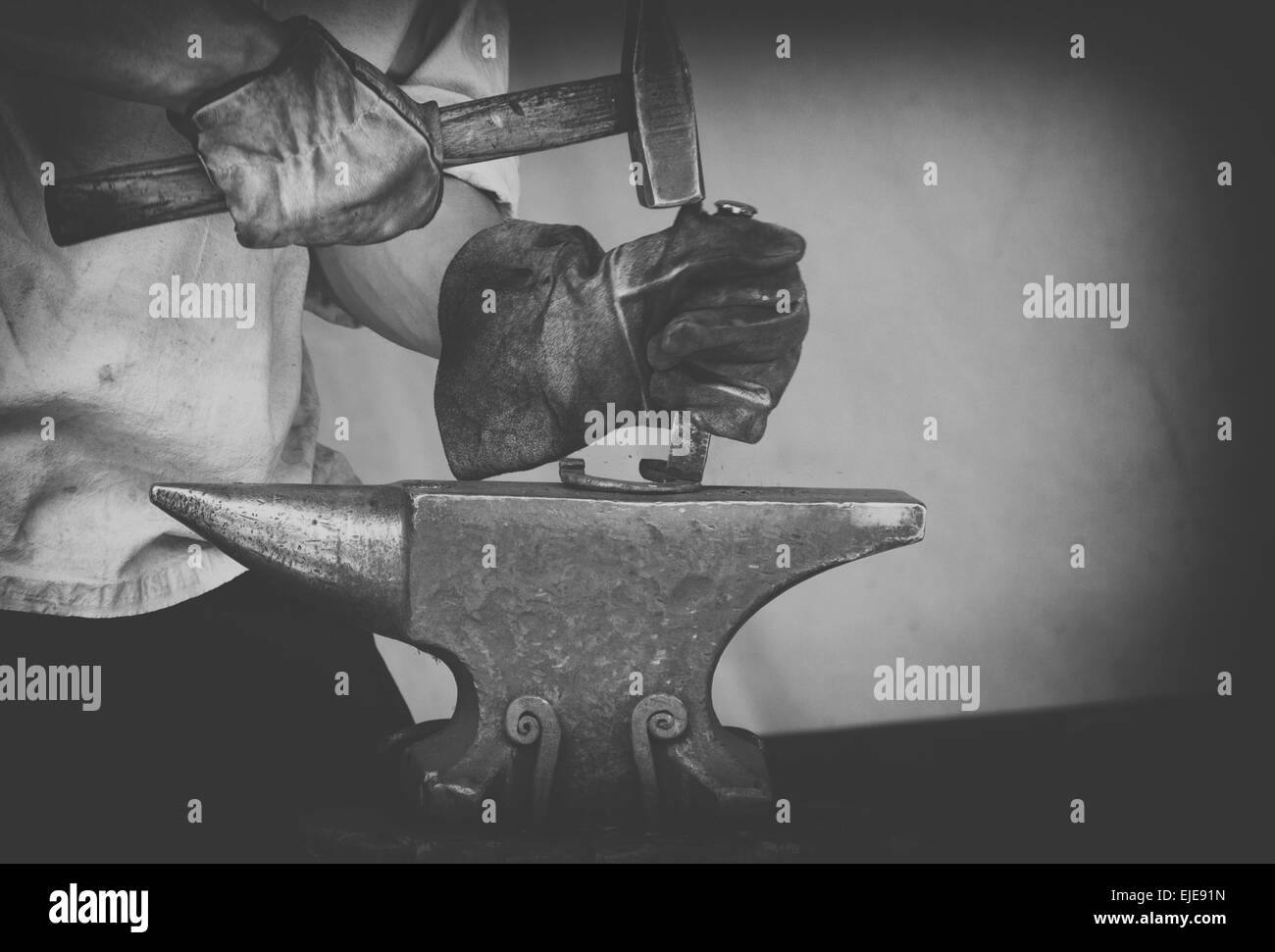 vintage photo Detail shot of metal being worked at a blacksmith forge ...