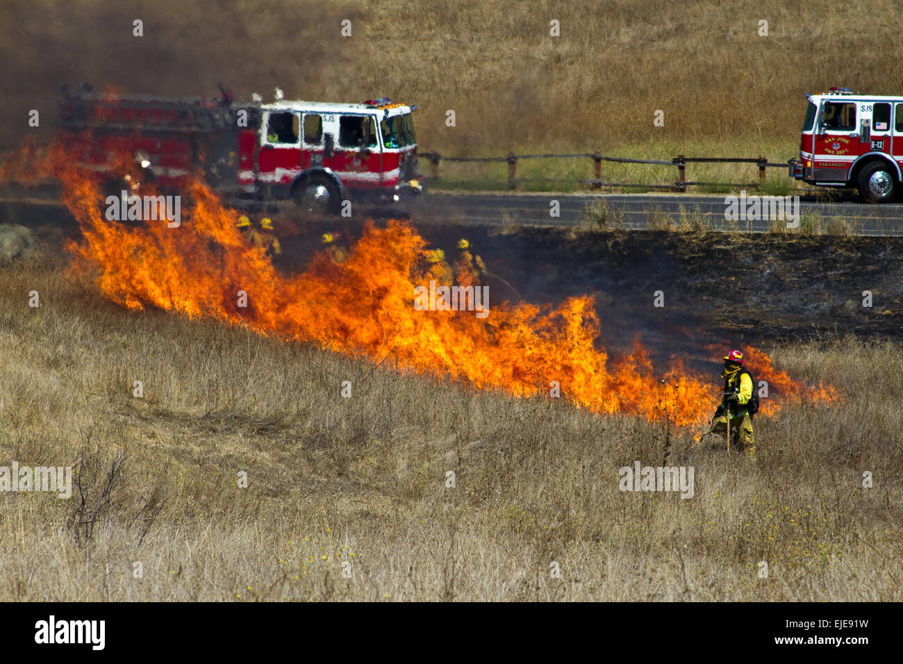 Firefighter Fighting Fire Stock Photo - Alamy