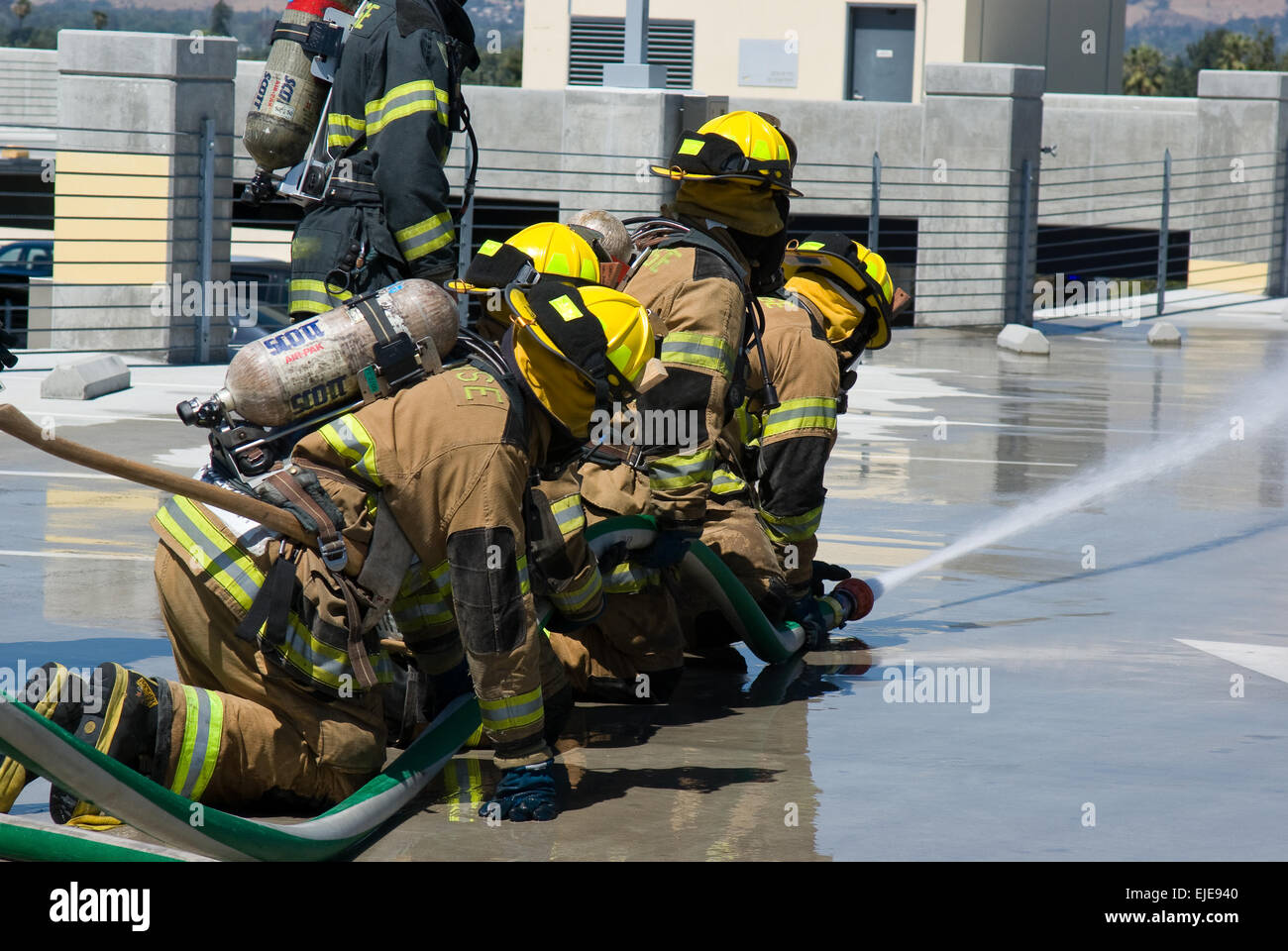 Firefighters Fighting Fire Stock Photo - Alamy