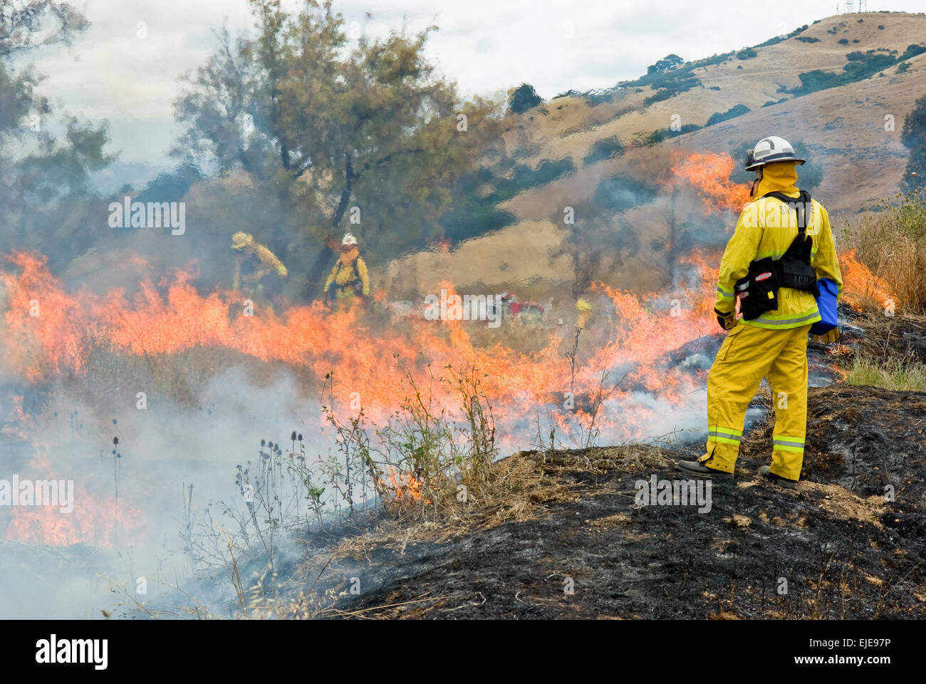 Firefighter Fighting Fire Stock Photo - Alamy