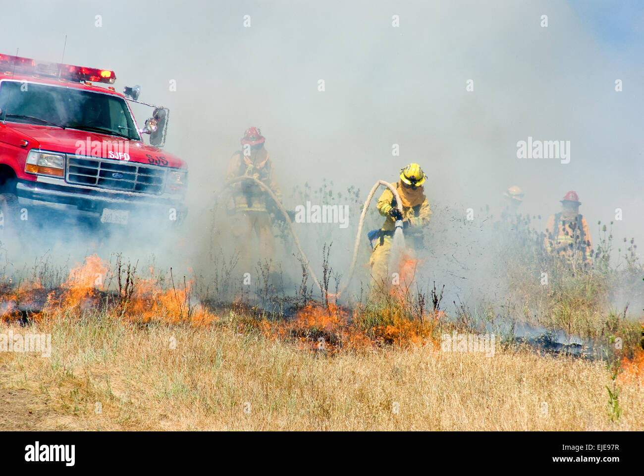 Firefighter Fighting Fire Stock Photo - Alamy