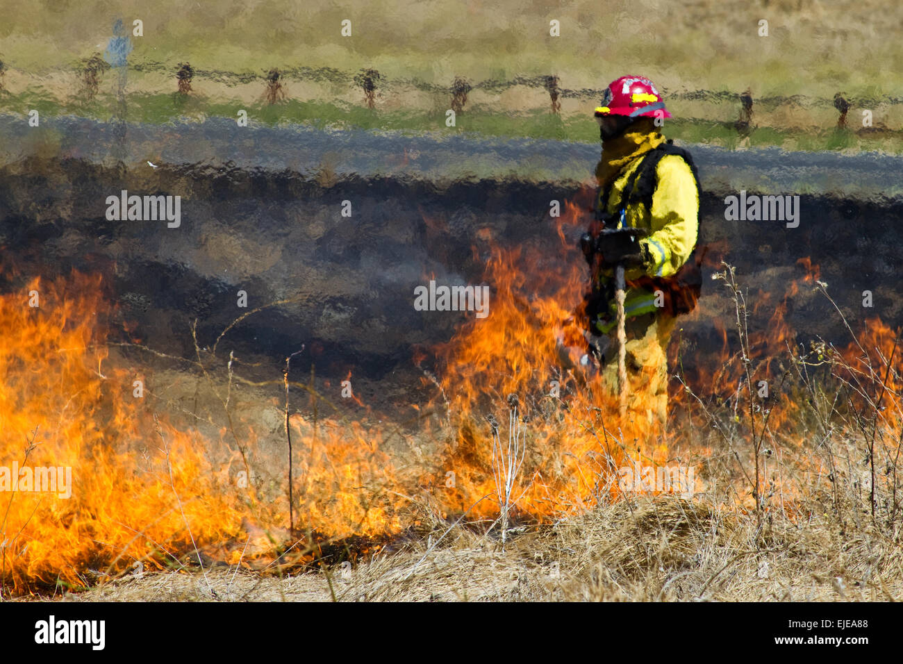 Firefighter Fighting Fire Stock Photo - Alamy