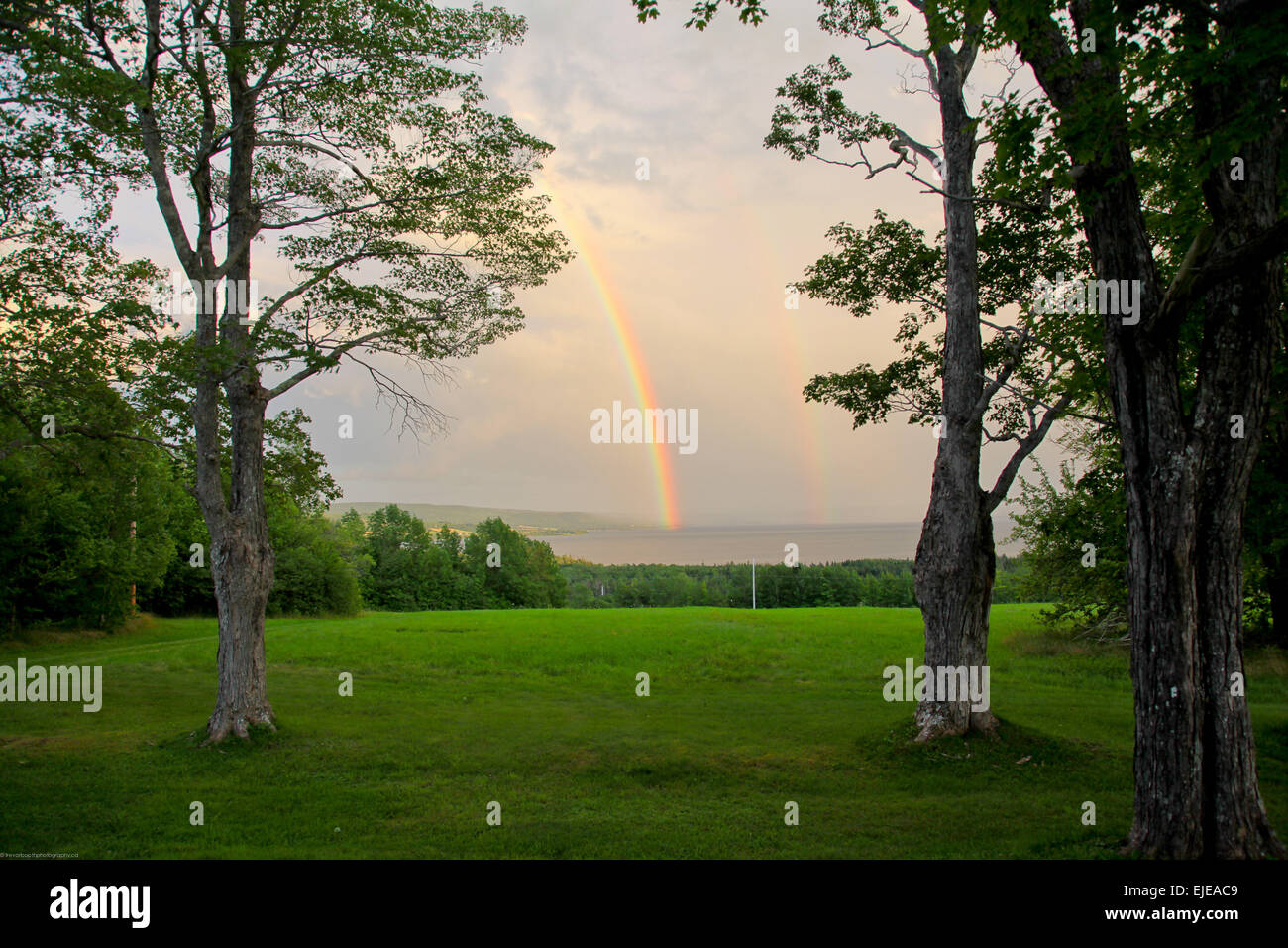 rainbow over lake Stock Photo - Alamy