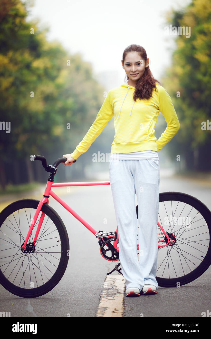 Asian girl riding a bicycle exercise Stock Photo - Alamy