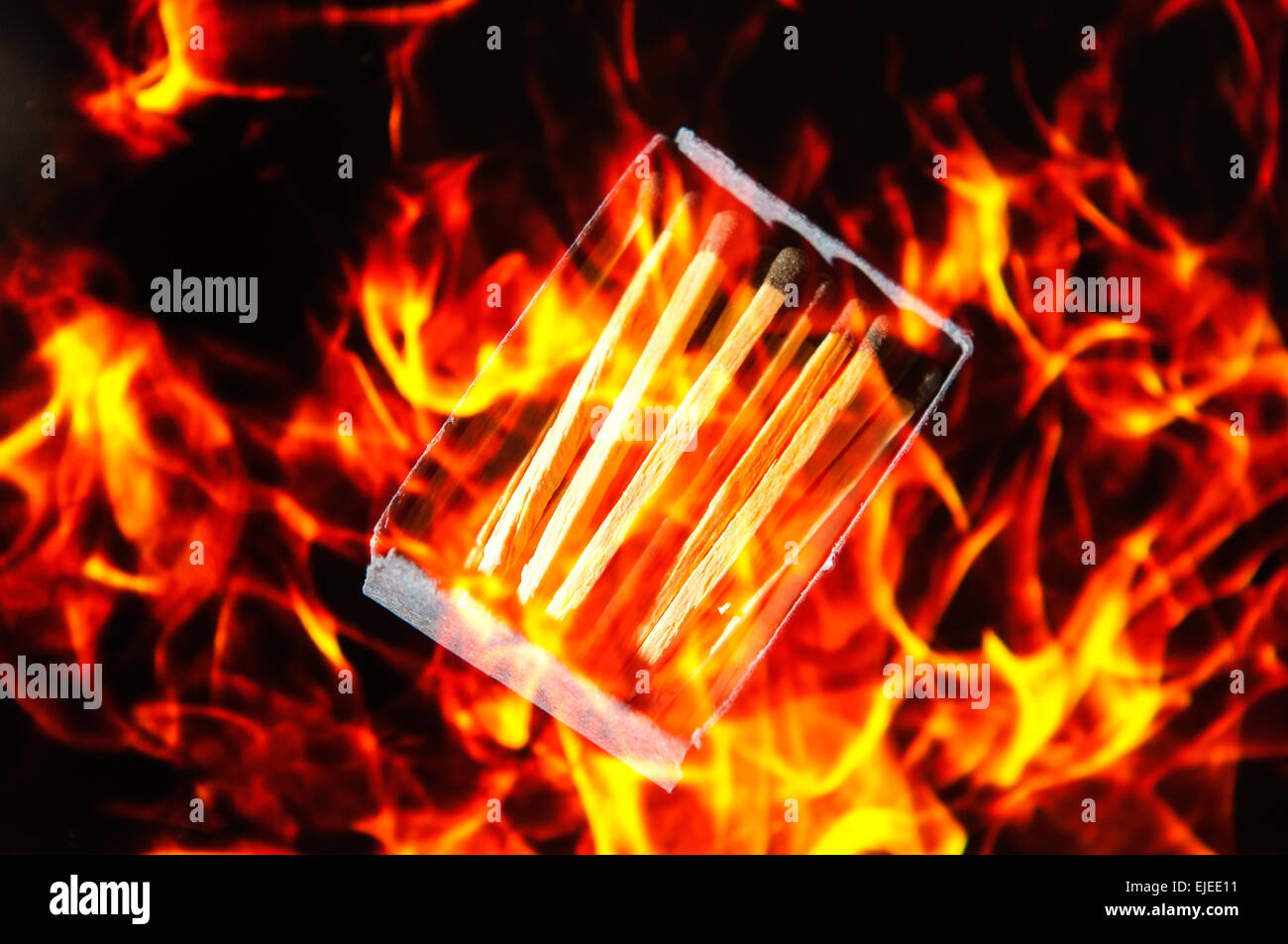 Box of matches superimposed with fire in studio setting Stock Photo - Alamy