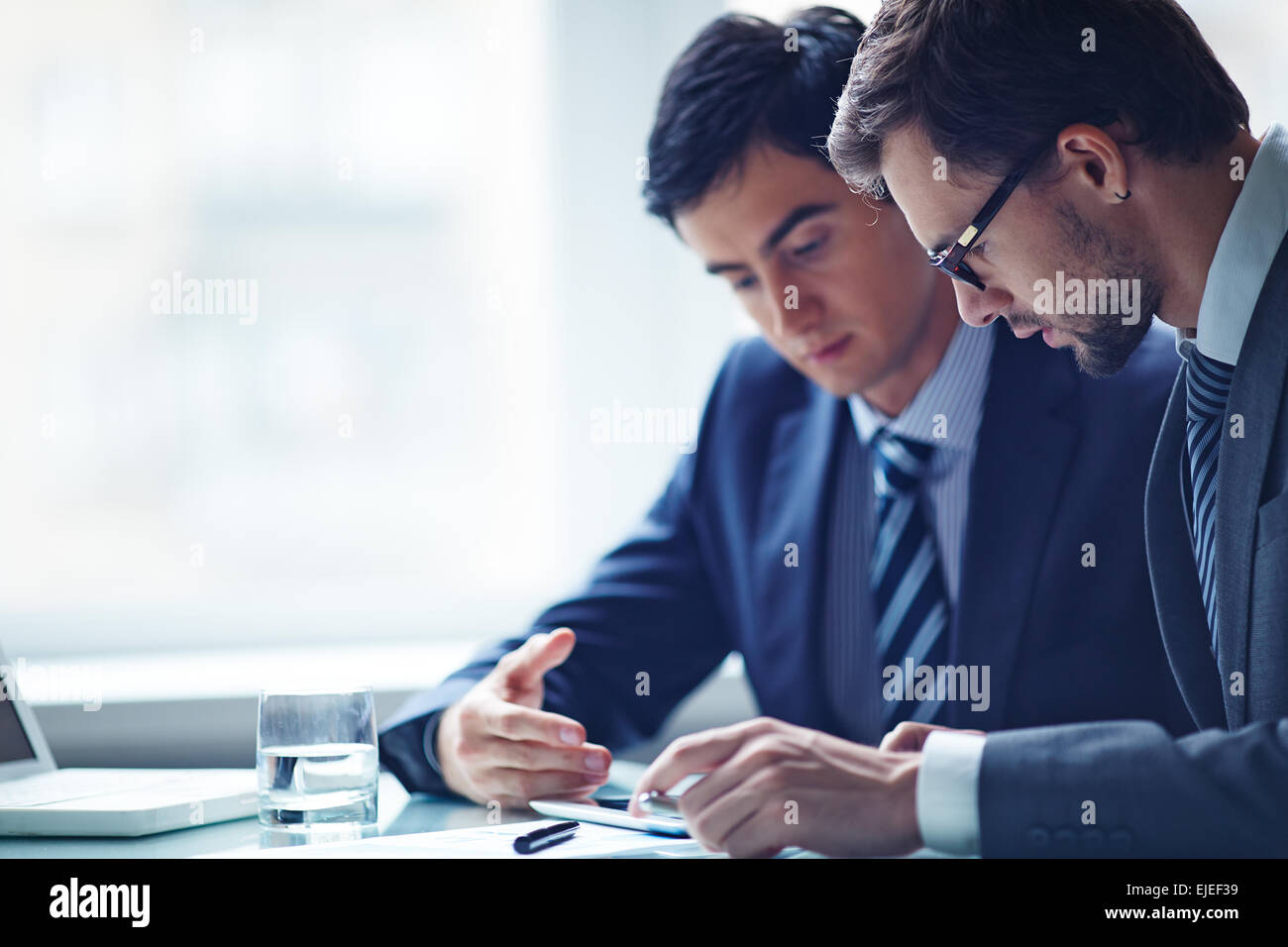 Two confident businessmen networking in office Stock Photo - Alamy