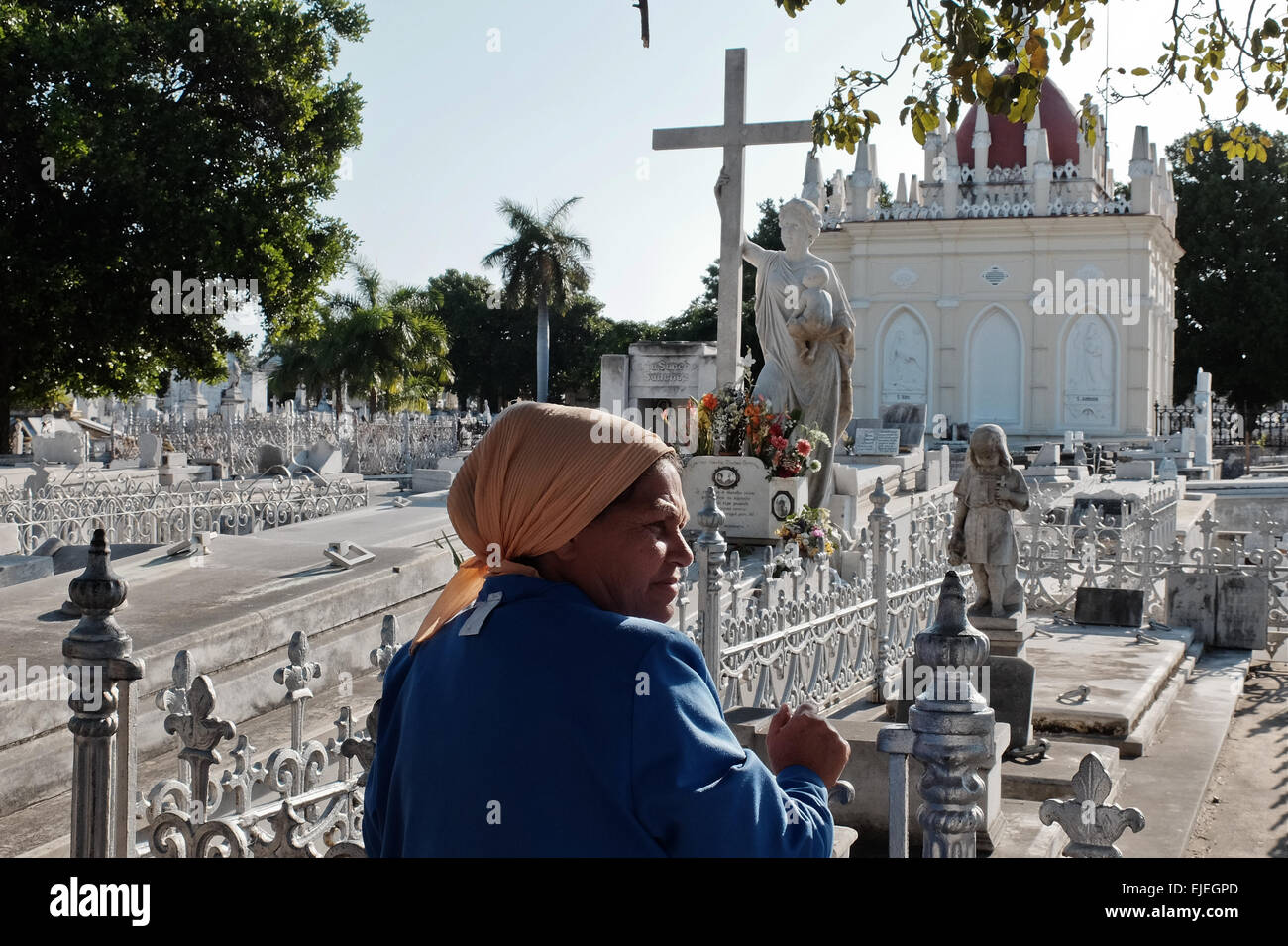 A woman prays for love and fertility, as is the custom beside the grave ...