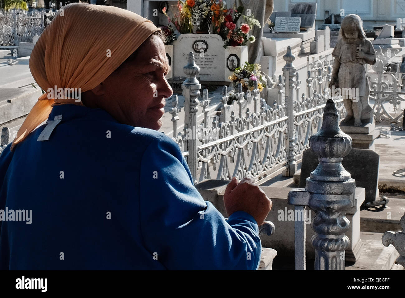 A woman prays for love and fertility, as is the custom beside the grave ...