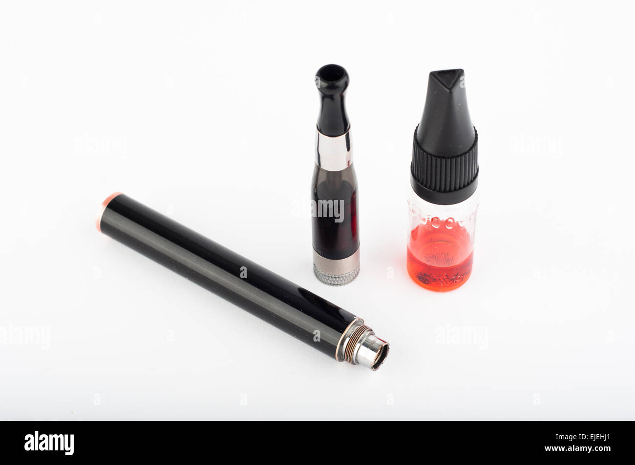 Photo of electronic Cigarette and liquid against white background Stock ...