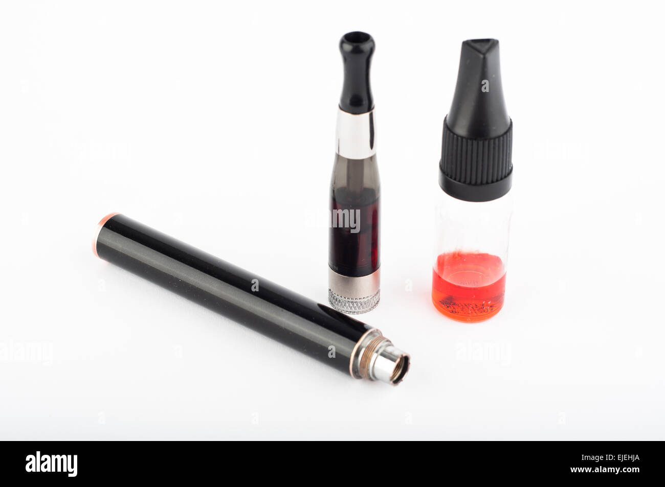 Photo of electronic Cigarette and liquid against white background Stock ...