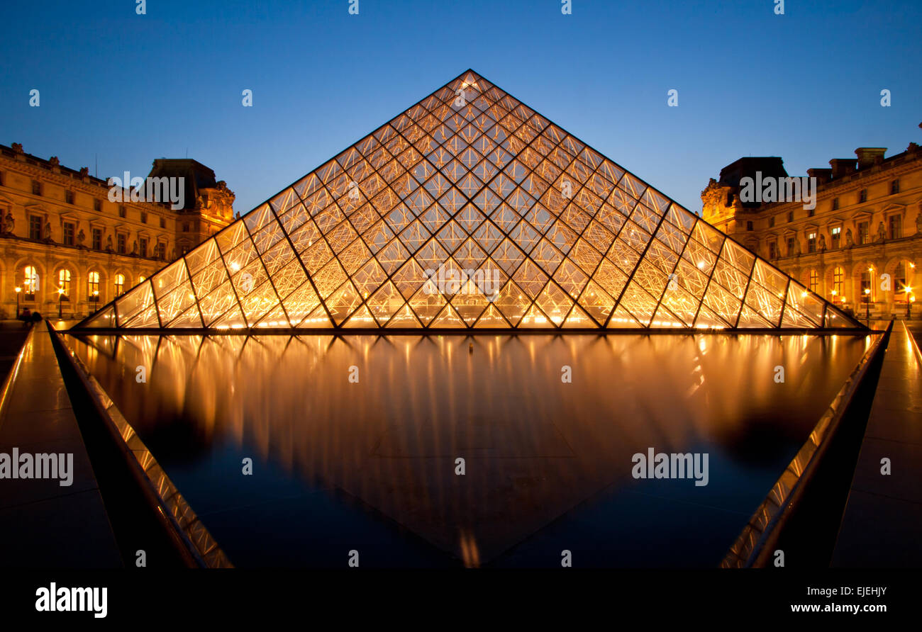 PARIS-APRIL 16: Reflection of Louvre pyramid shines at dusk during the ...