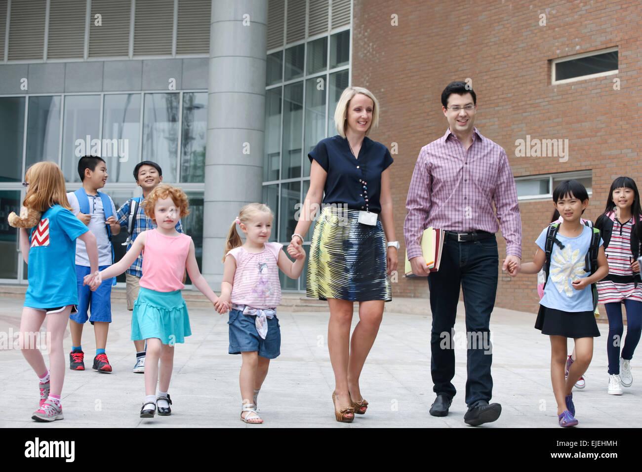 The international primary school teachers and students Stock Photo - Alamy