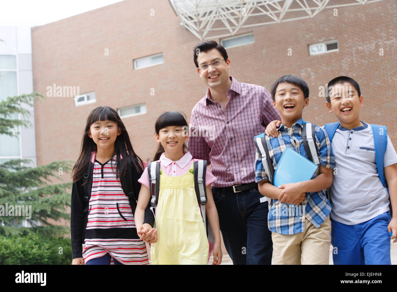 The international primary school teachers and students Stock Photo - Alamy