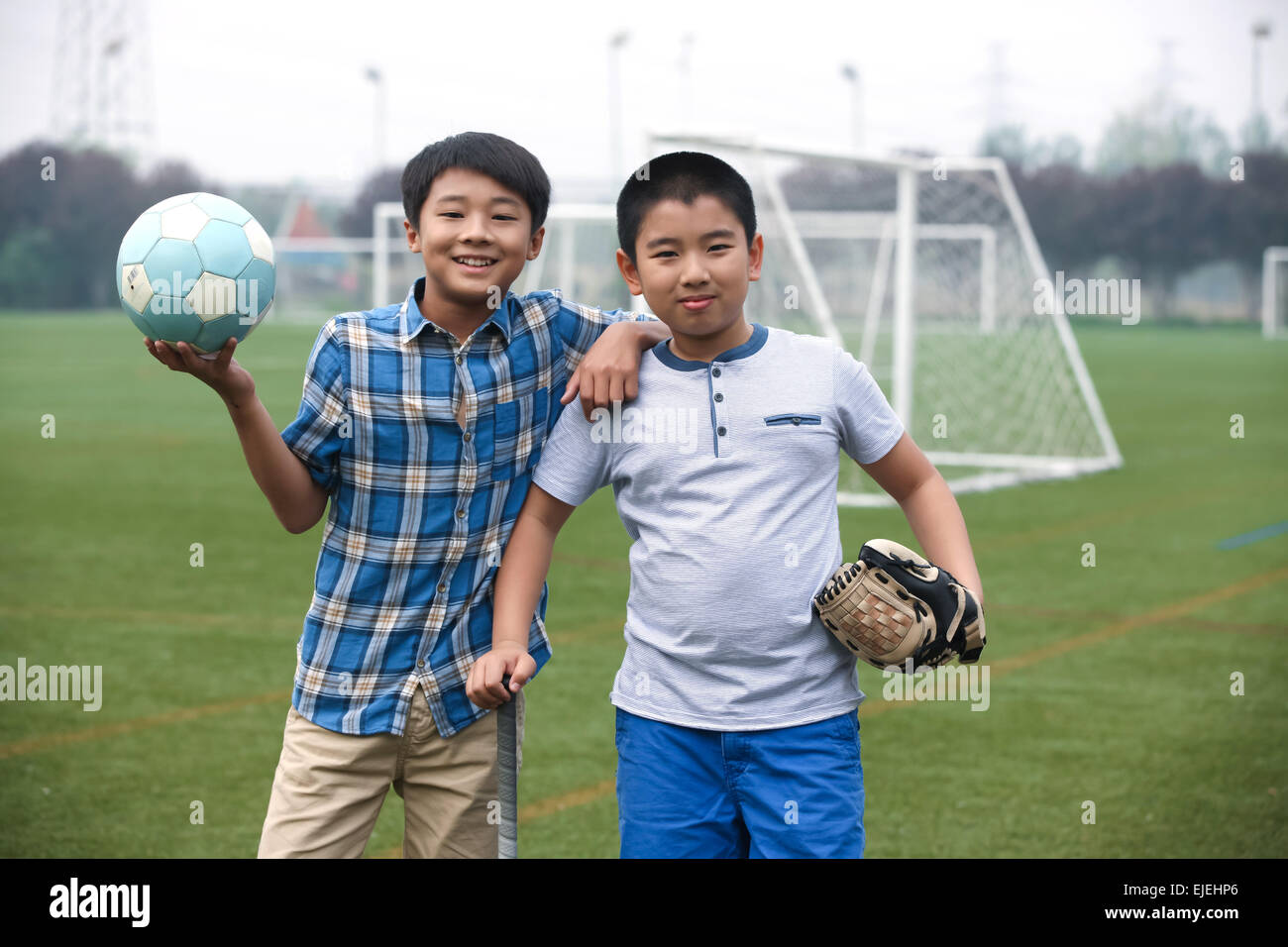 Two primary school boys on the football field Stock Photo - Alamy