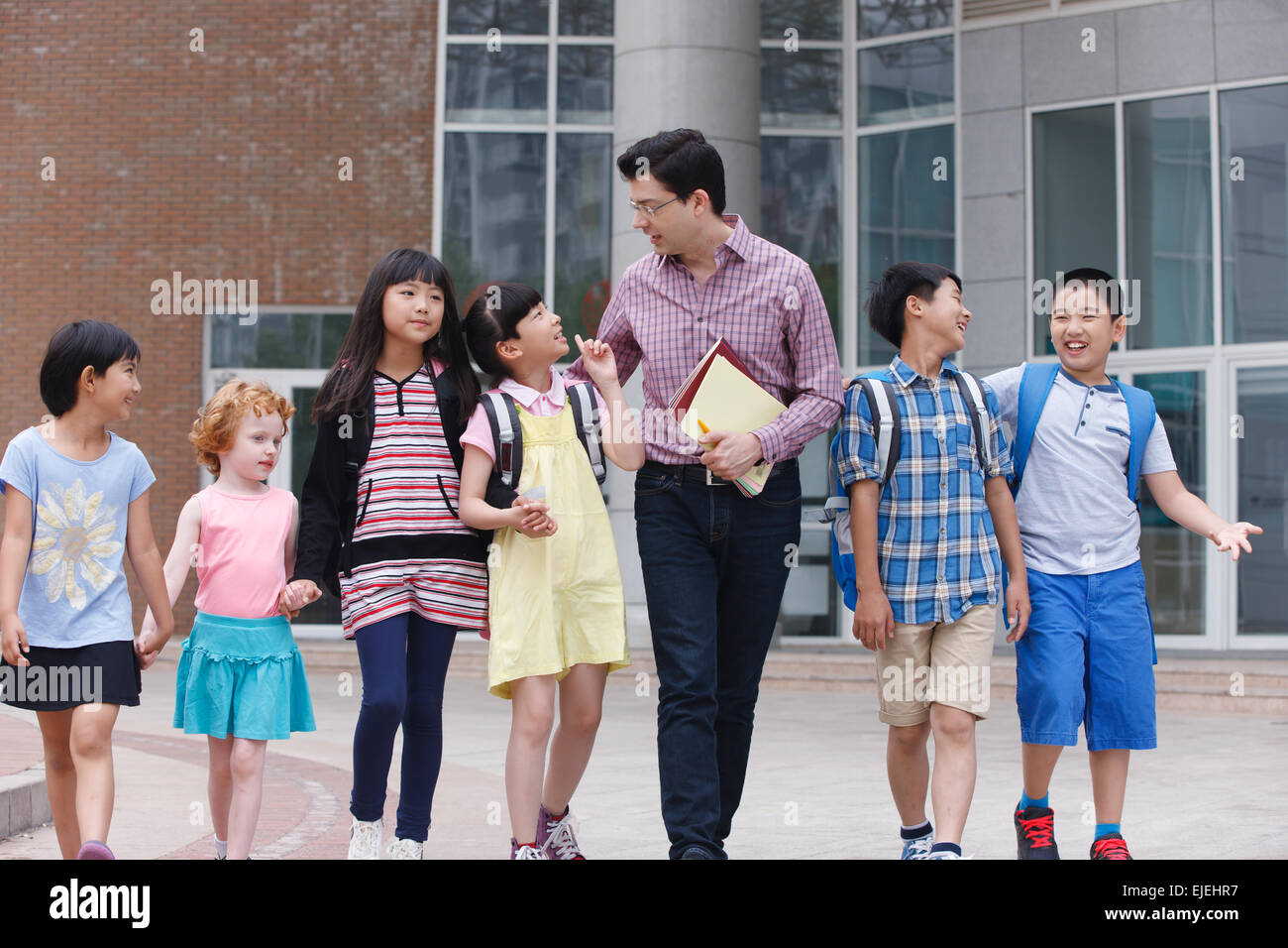 The international primary school teachers and students Stock Photo - Alamy