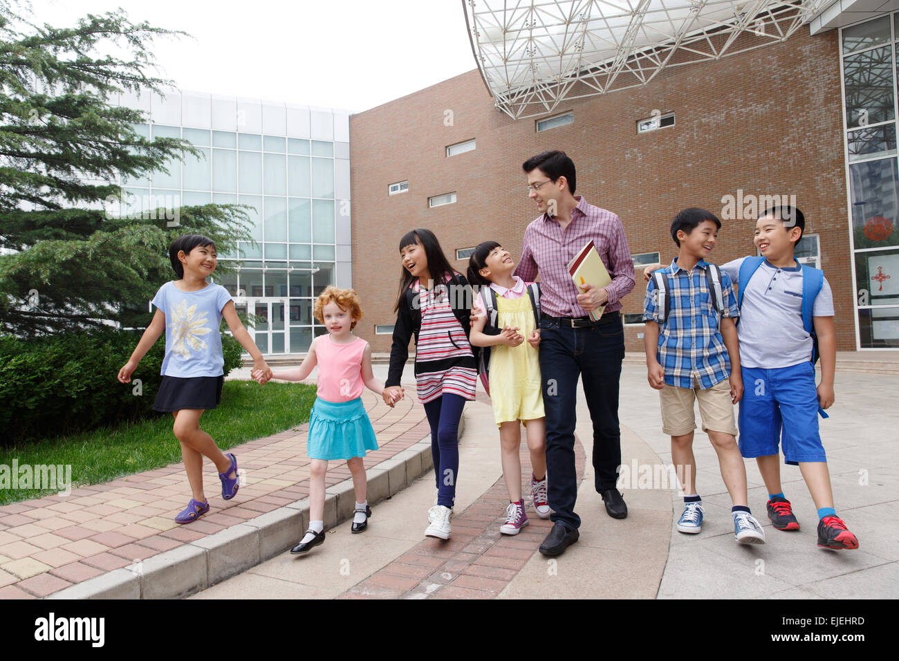 The international primary school teachers and students Stock Photo - Alamy